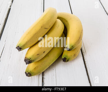 Fresh bananas on wooden background Stock Photo - Alamy