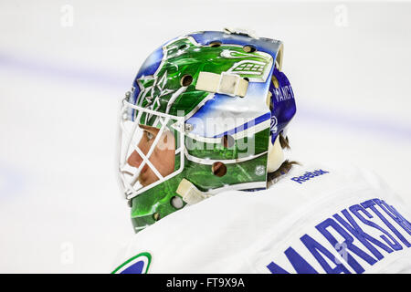 Vancouver Canucks goalie Jacob Markstrom, right, of Sweden, slides ...