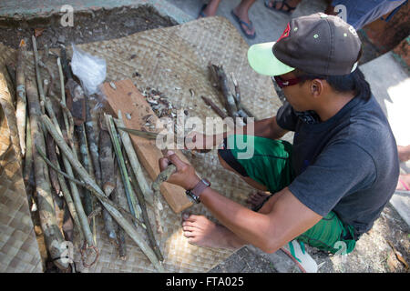 The chopping of traditional herbs and plants collected by Healers ...