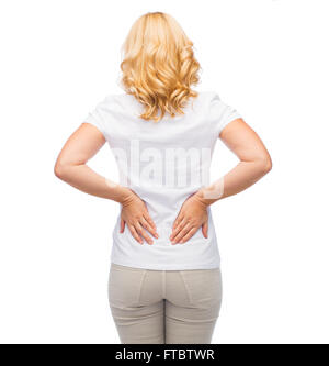 Back view of woman suffering from backache, waist pain, muscle or ...