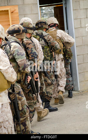 ROTA, Spain (Oct. 3, 2013) - A Spanish infantry marine listens as U.S ...