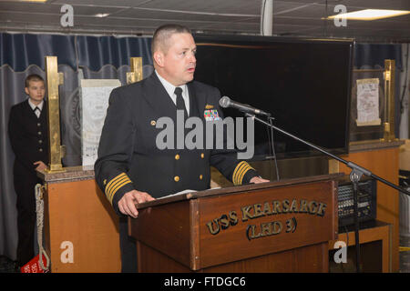 Capt. David Bossert, commanding officer USS Kearsarge (LHD 3), gives a ...