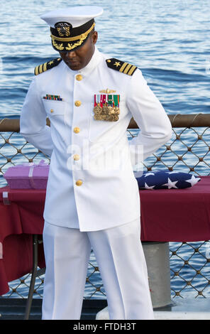 Cmdr. Timothy Moore of the USS Donald Cook (DDG 75) inspects uniforms ...