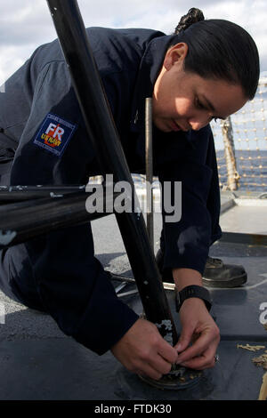 Fire Controlman 1st Class Marisol Erving loads a Mark 46 torpedo into a ...