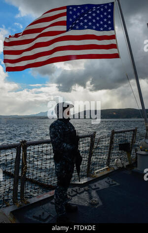 Fire Controlman 2nd Class Azareel Castro moves a Mark 46 torpedo aboard ...