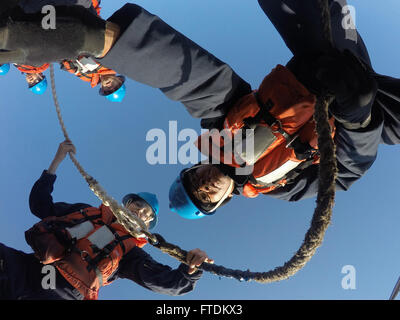 Sailors aboard USS Carney, an Arleigh Burke-class guided-missile ...