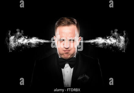 Businessman with smoke coming out of his ears Stock Photo - Alamy