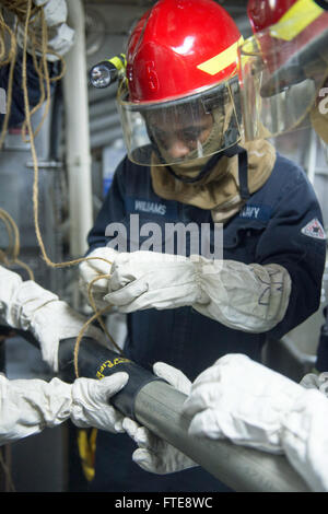 This image shows Damage Controlman 3rd Class Brandon Williams and Hull ...