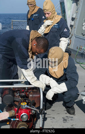 Damage Controlman 3rd Class Brandon Williams applies an Emergency Water ...