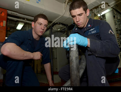 right, trains Damage Controlman Fireman Isaac Whaley, center, and Hull ...