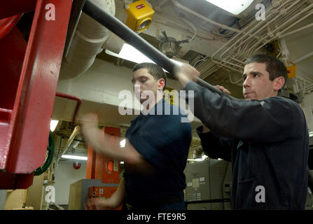 right, trains Damage Controlman Fireman Isaac Whaley, center, and Hull ...