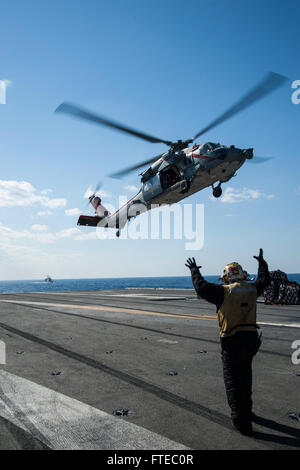 This image shows Boatswain's Mate 2nd Class Brandon Foor securing a ...