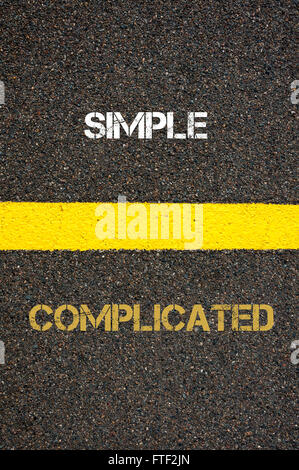 Antonym concept of SIMPLE versus COMPLICATED written over tarmac, road ...