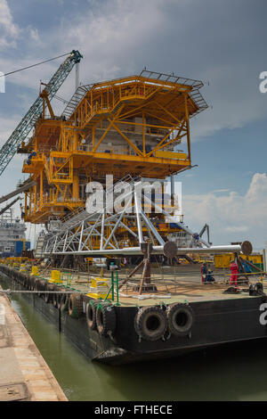 Oil rig topside on a barge before sailing away Stock Photo - Alamy