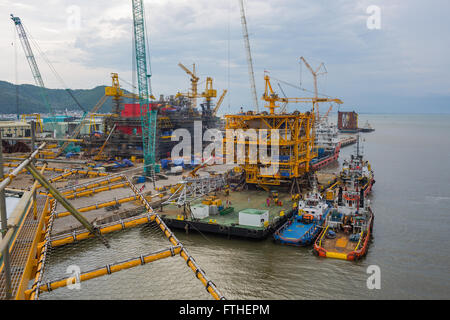 Oil rig topside on a barge before sailing away Stock Photo - Alamy