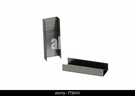 Staples on white background Stock Photo - Alamy