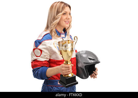 Cheerful female car racer holding a model car and pointing isolated on ...