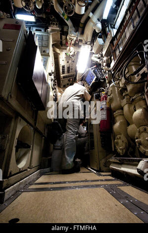 ONE-MAN SUBMARINE BUILT IN ' PREFAB ' GARDEN Behind a ' prefab ' house ...