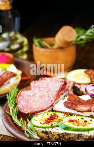 Tasty homemade tapas with different fillings on the table Stock Photo ...