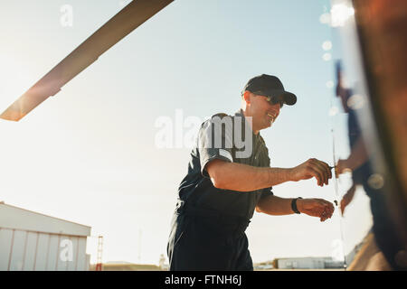 Pilot doing pre flight inspection on his sports plane Stock Photo - Alamy