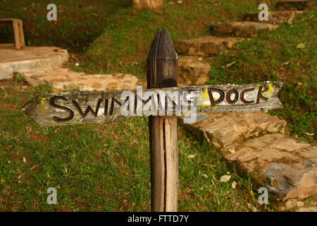 An unique wooden sign for a swimming dock Stock Photo - Alamy