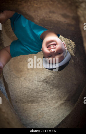 Exploring the cave Stock Photo - Alamy