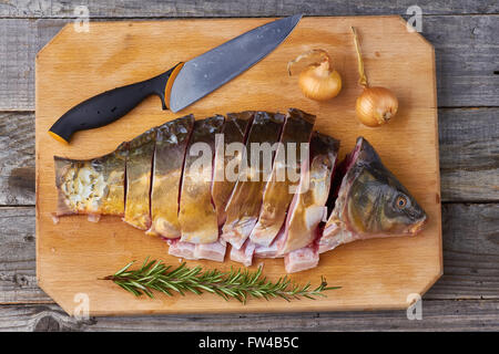 Sliced piece of raw fresh freshwater fish preparing for cooking Stock ...