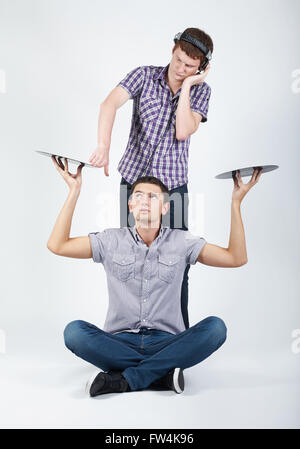 two crazy guys with plates Stock Photo - Alamy