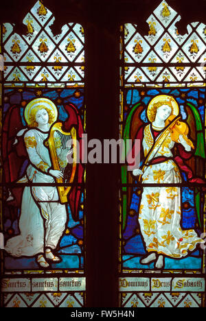 Angels playing musical instruments, fiddle, pipe, trumpet stained glass ...