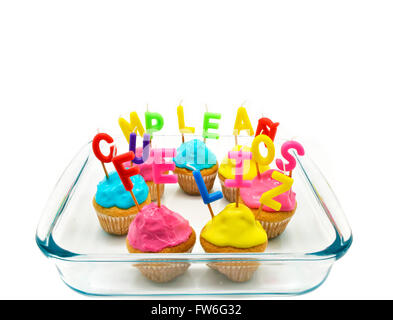 Birthday cupcakes with candles happy birthday in Spanish Stock Photo ...