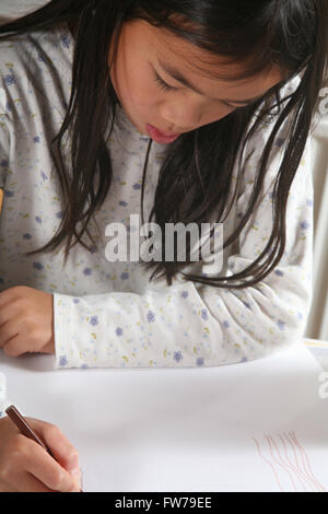 child reading a book ans studying (Chinese child Stock Photo - Alamy