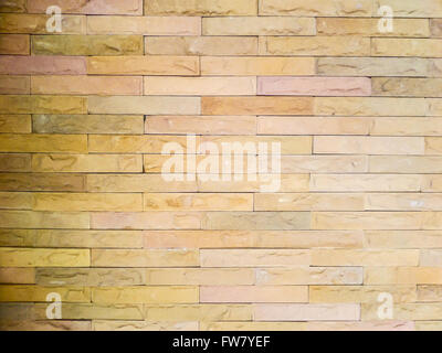 Stone tile wall and earth tone color Stock Photo - Alamy