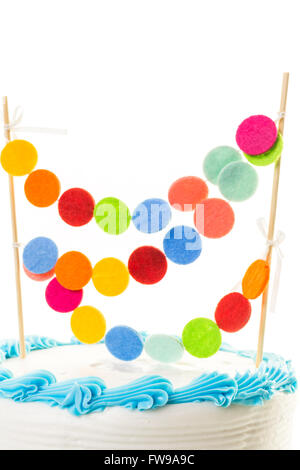 Simple white Birthday cake with cake garland Stock Photo - Alamy