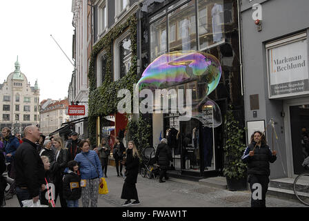 COPENHAGEN / DENMARK 02 April 2016 Male entertaining wih soap bubble on ...