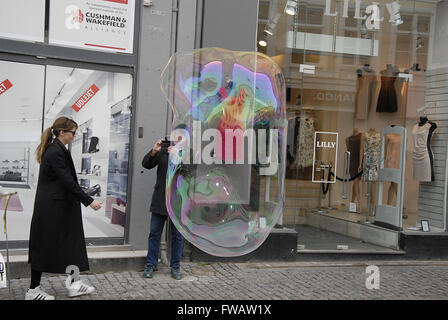 COPENHAGEN / DENMARK 02 April 2016 Male entertaining wih soap bubble on ...