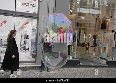 COPENHAGEN / DENMARK 02 April 2016 Male entertaining wih soap bubble on ...