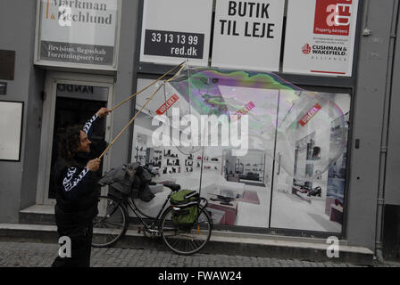 COPENHAGEN / DENMARK 02 April 2016 Male entertaining wih soap bubble on ...