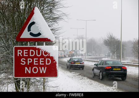 Reduce speed now sign for roundabout in England. Showing traffic and ...