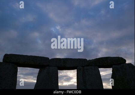 A reveler at the ancient stone circle Stonehenge to celebrate the ...