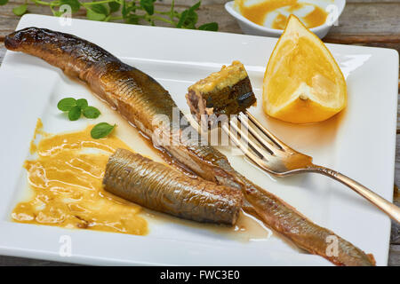Stewed lamprey on plate Stock Photo - Alamy