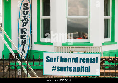 Surf lesson and board rental sign, tourist activities on Legian Beach ...