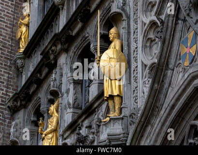 Guilded stone statues at the Basilica of the Holy Blood in Bruges ...