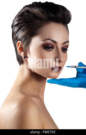 Portrait of attractive woman getting injection isolated on white Stock ...