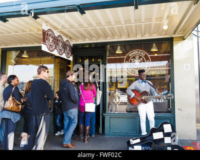 People line up at the first Starbucks store on its opening day in ...