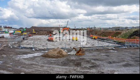 Construction of a new road layout with a digger and coned off area of ...