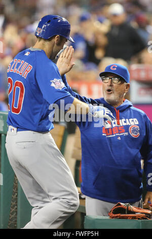Los Angeles Angels manager Joe Maddon talks to a player before a spring ...