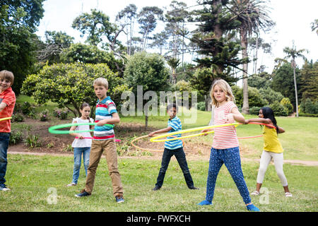 Children playing with hula hoops Stock Photo: 30670666 - Alamy