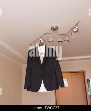 Office male clothes on hangers, isolated on white Stock Photo - Alamy