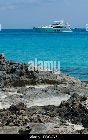 rocks blue sea, boats on the water travel and leisure Stock Photo - Alamy