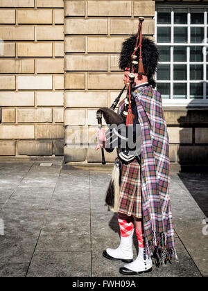 Bagpipe player. A standing bagpipe player Stock Photo - Alamy
